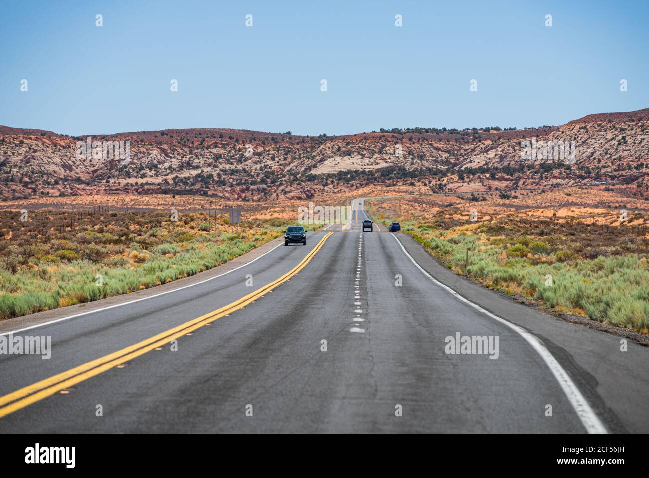 Asphalt road in USA. Empty asphalt highway and blue sky. Long Desert ...