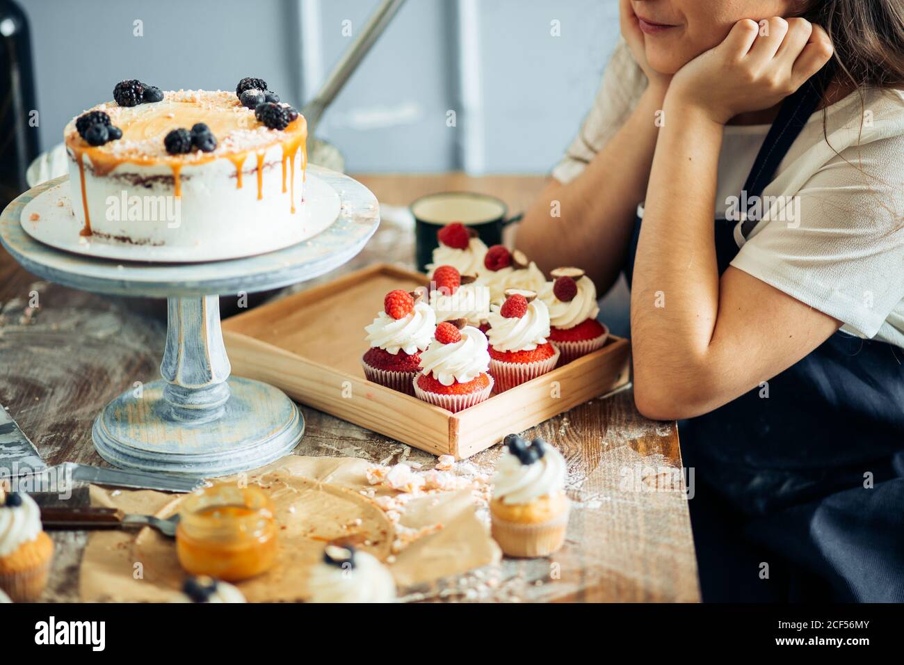Young woman girl secretly eating cake Stock Photo - Alamy