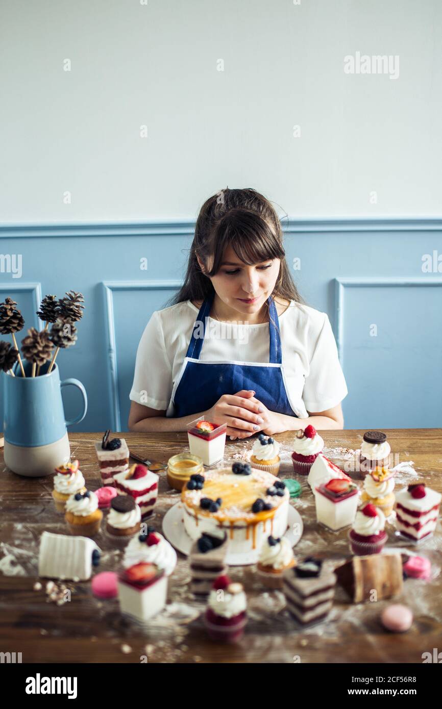 Young woman girl secretly eating cake Stock Photo - Alamy