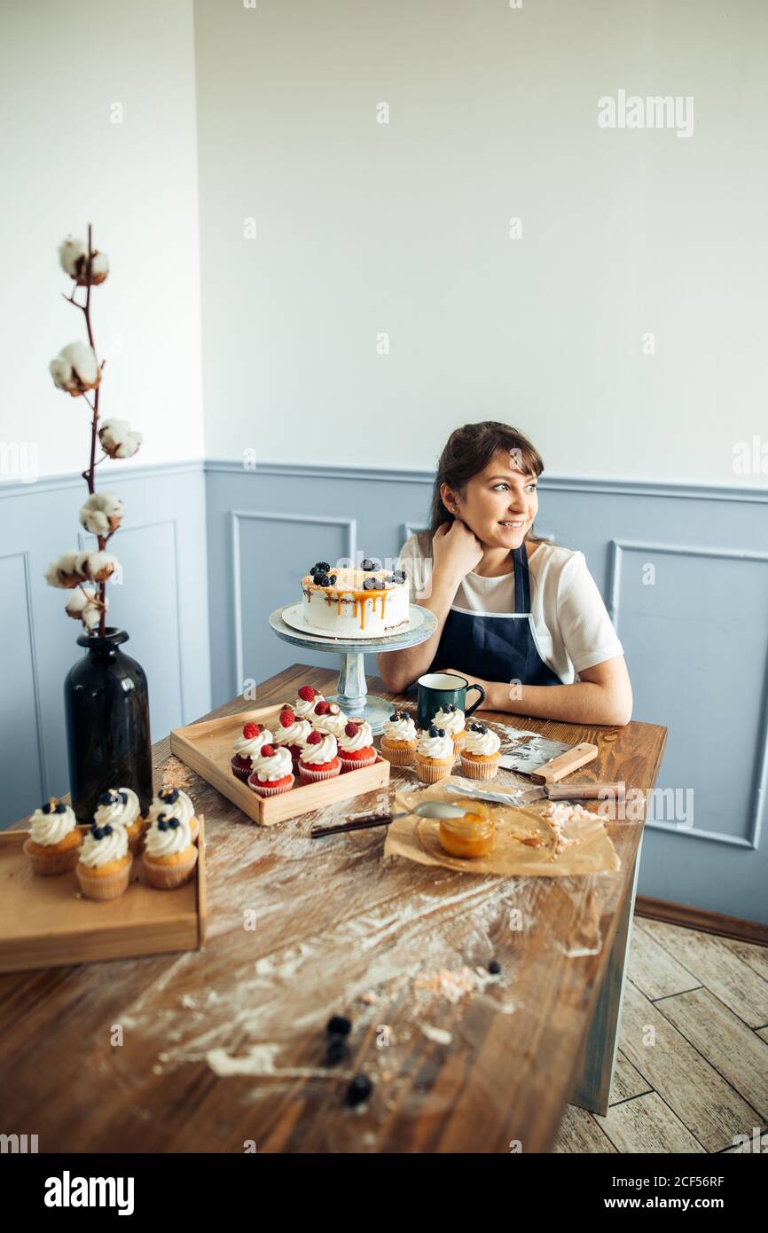 Young woman girl secretly eating cake Stock Photo - Alamy
