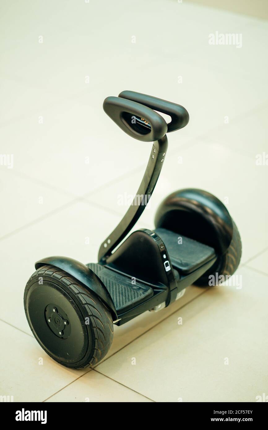 Segway on parquet. electric scooter. black gyrometer Stock Photo - Alamy