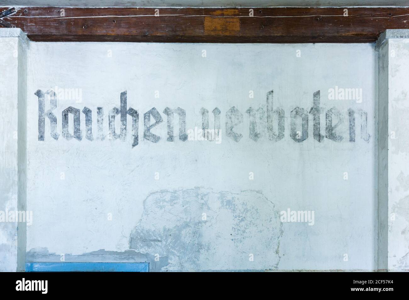 Fading German "Rauchen Verboten" (No Smoking) sign painted on wall in ...