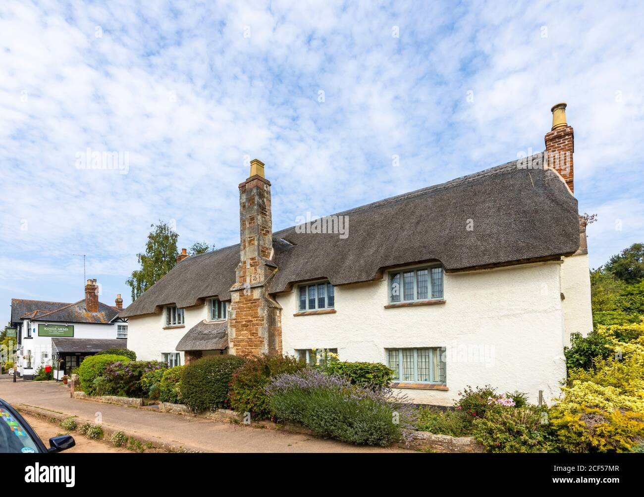 A pretty roadside thatched cottage at Otterton, a picturesque quaint ...