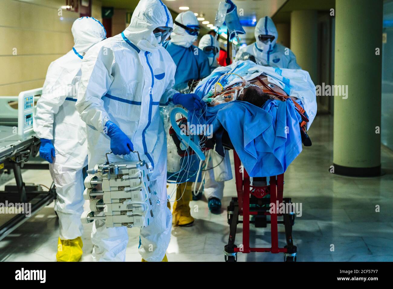 Group of unrecognizable professional doctors wearing protective masks ...