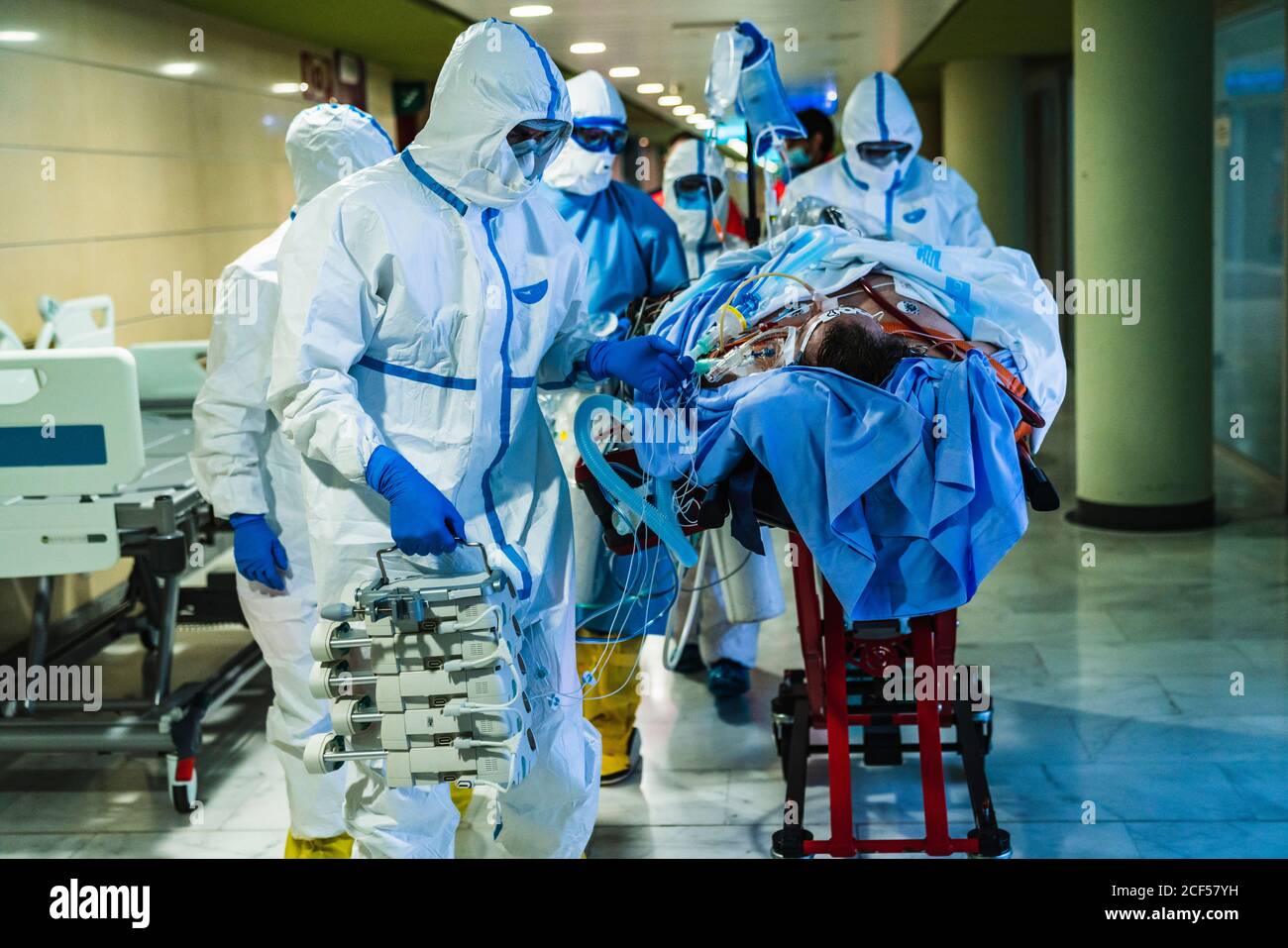 Group of unrecognizable professional doctors wearing protective masks ...