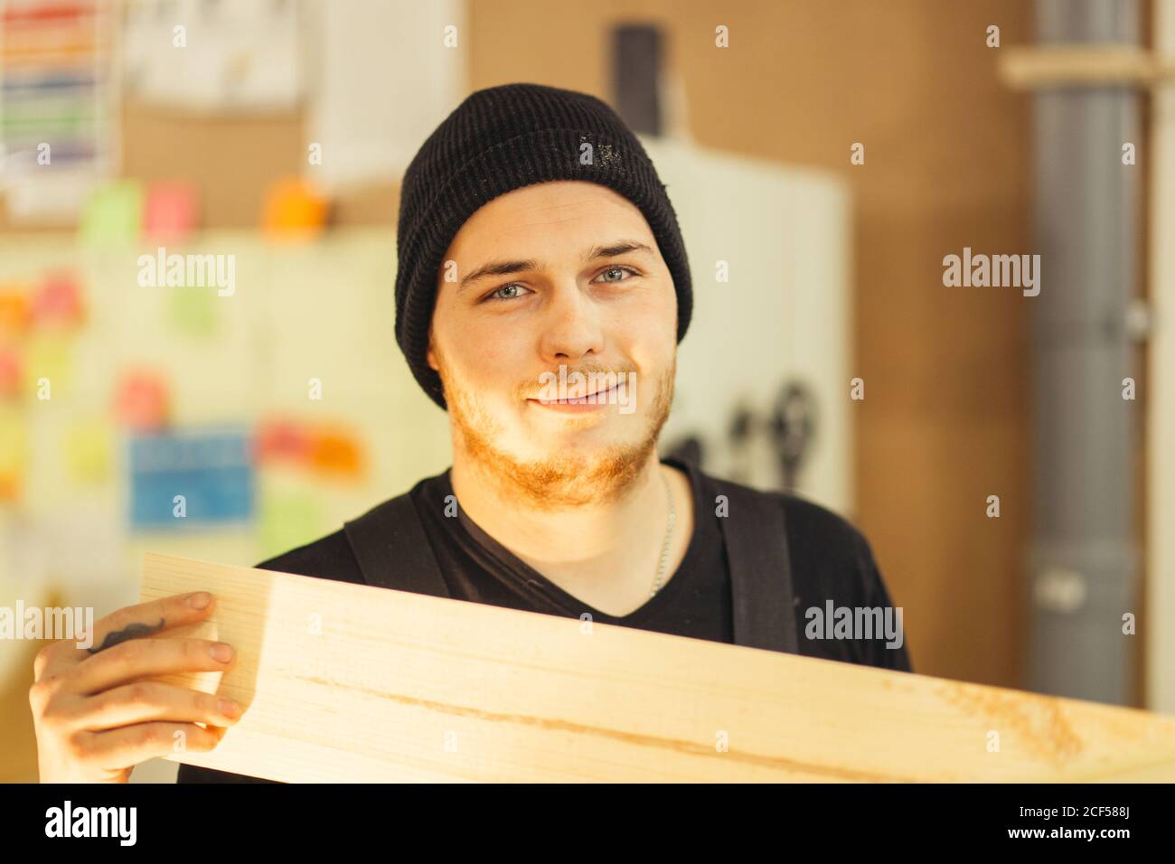 Smiling carpenters in front of their workbench Stock Photo - Alamy