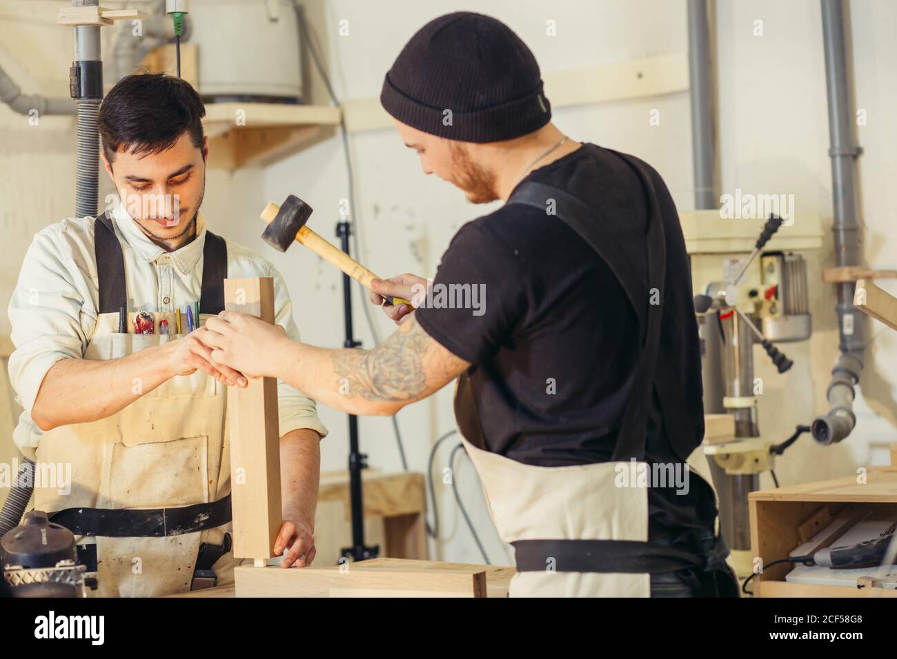 Construction Worker Building Timber Frame In New Home Stock Photo - Alamy