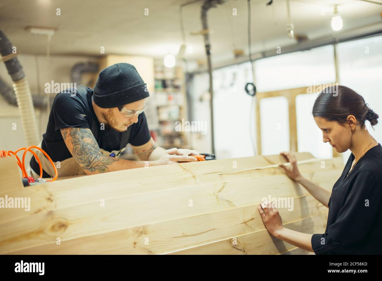 Carpenter applying wood glue brush hi-res stock photography and images ...