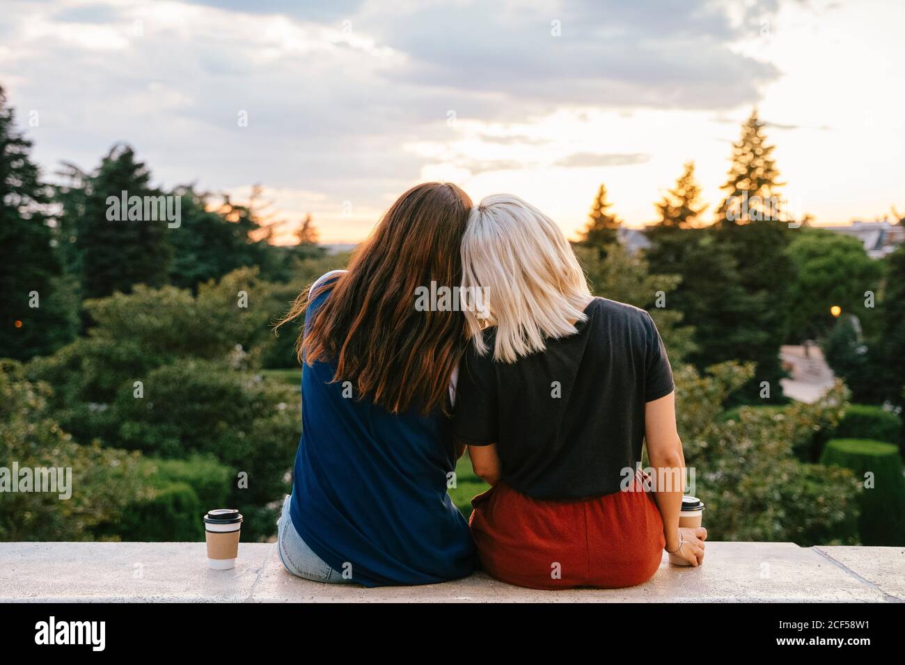 Women Leaning On Each Other High Resolution Stock Photography and ...