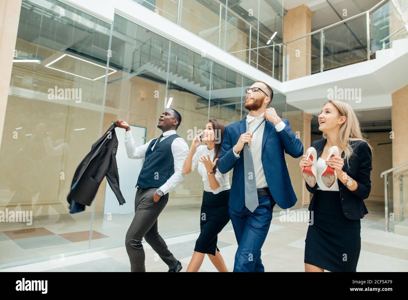 Happy business people celebrate success in the office. Successful ...