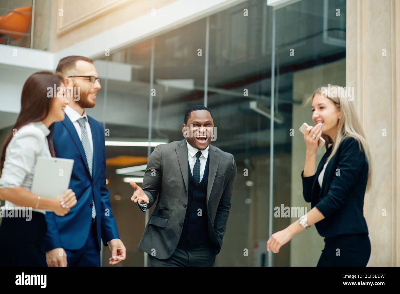 Happy business people celebrate success in the office. Successful ...