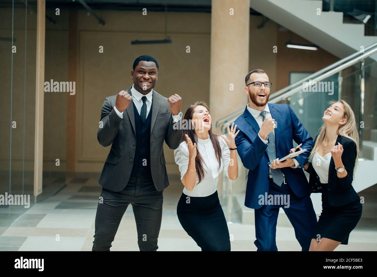Business team celebrating a triumph with arms up Stock Photo - Alamy