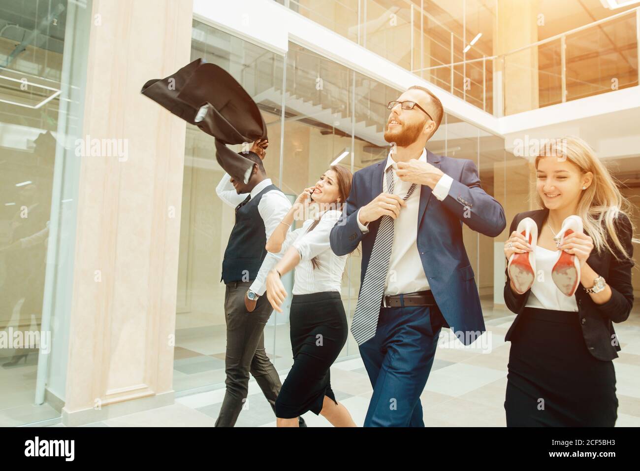 Happy business people celebrate success in the office. Successful ...