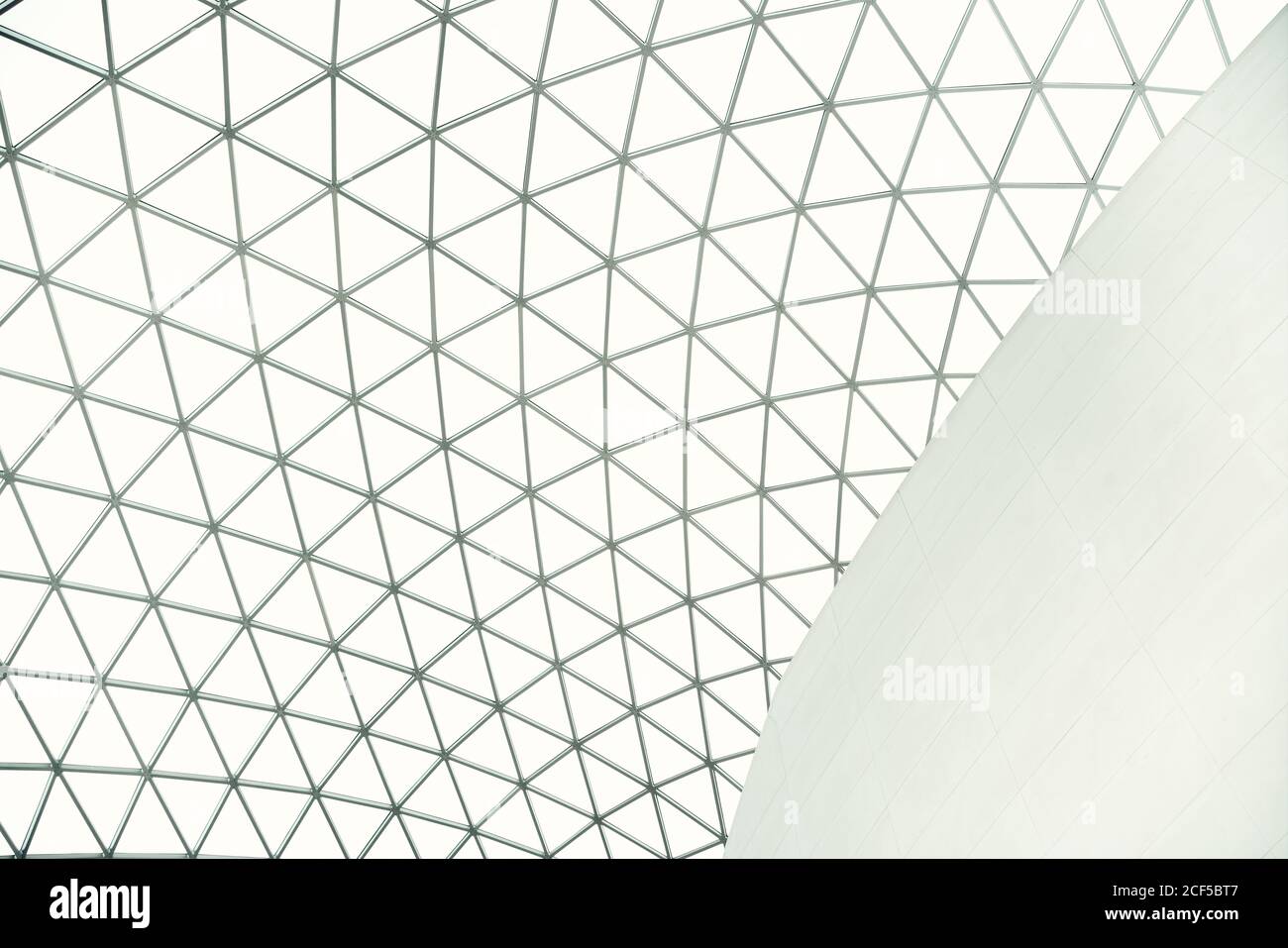 From below geometric dome ceiling of with many triangular parts inside ...