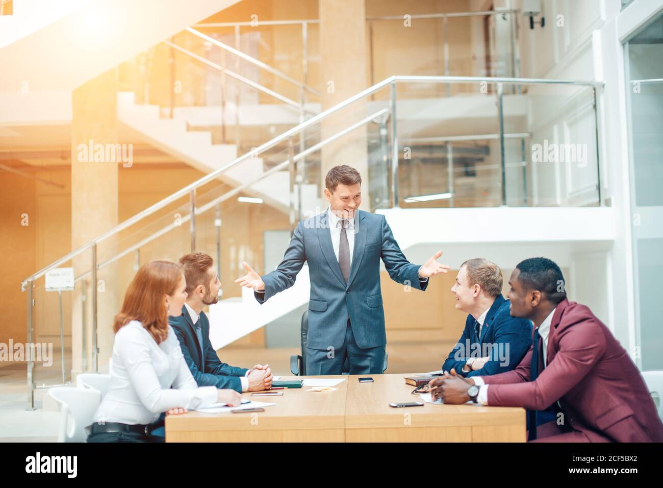 boss leader coaching and teaching in modern office. On the job training ...