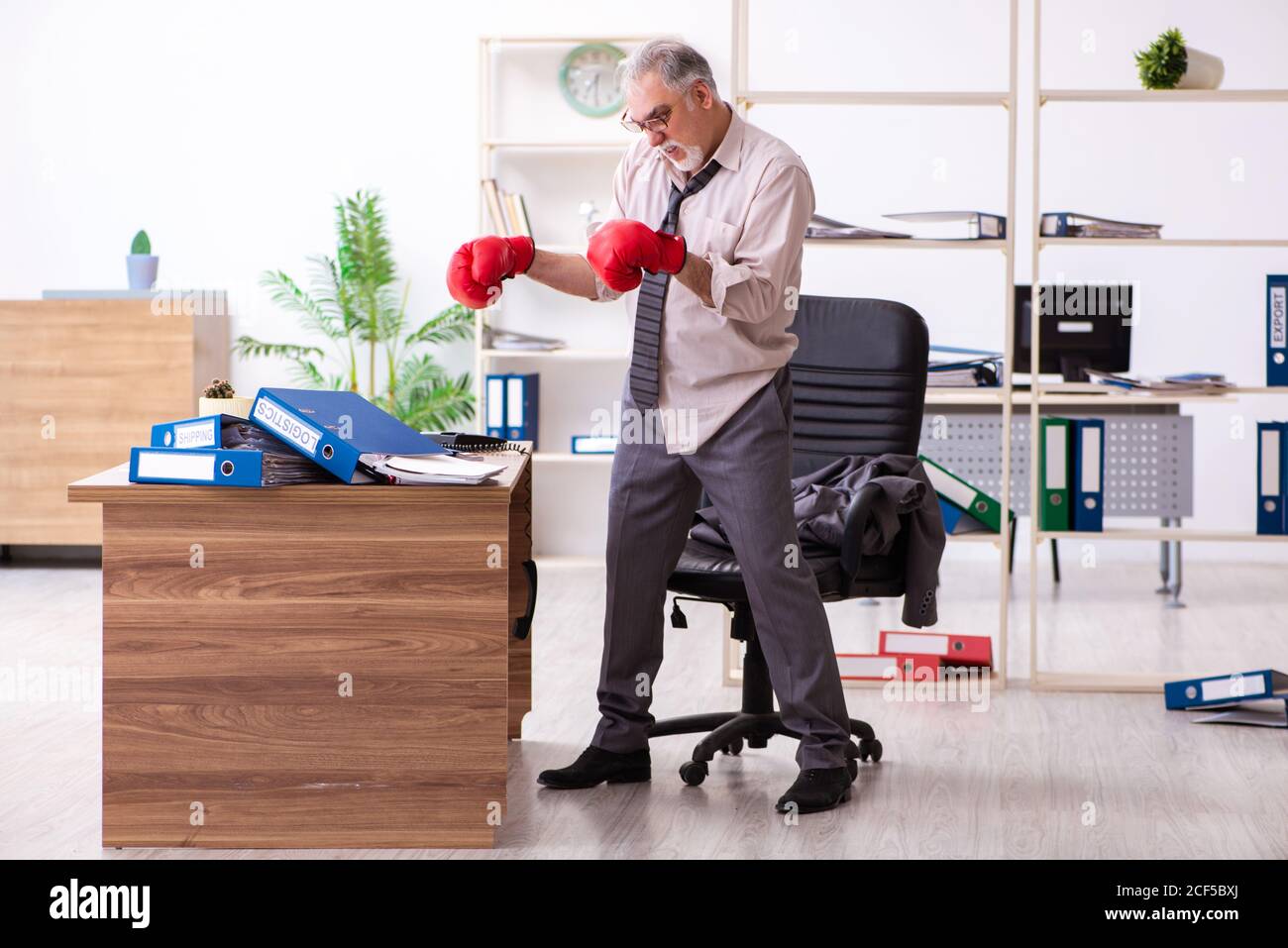 Businessman angry and furious at his workplace Stock Photo - Alamy