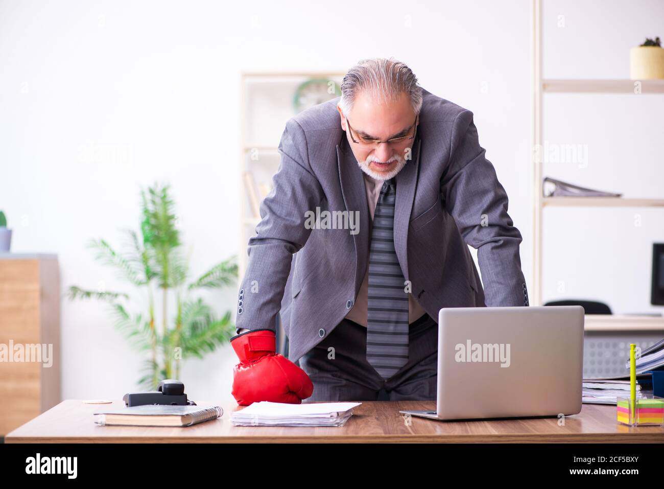 Businessman angry and furious at his workplace Stock Photo - Alamy