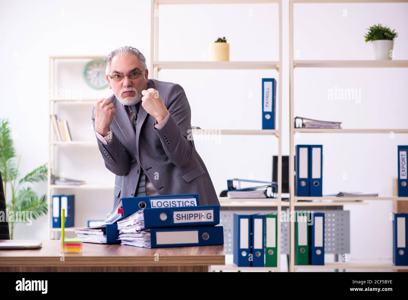 Businessman angry and furious at his workplace Stock Photo - Alamy
