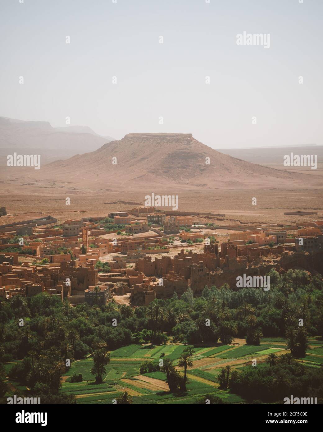 Picturesque view of green park and old city in desert land of Morocco ...