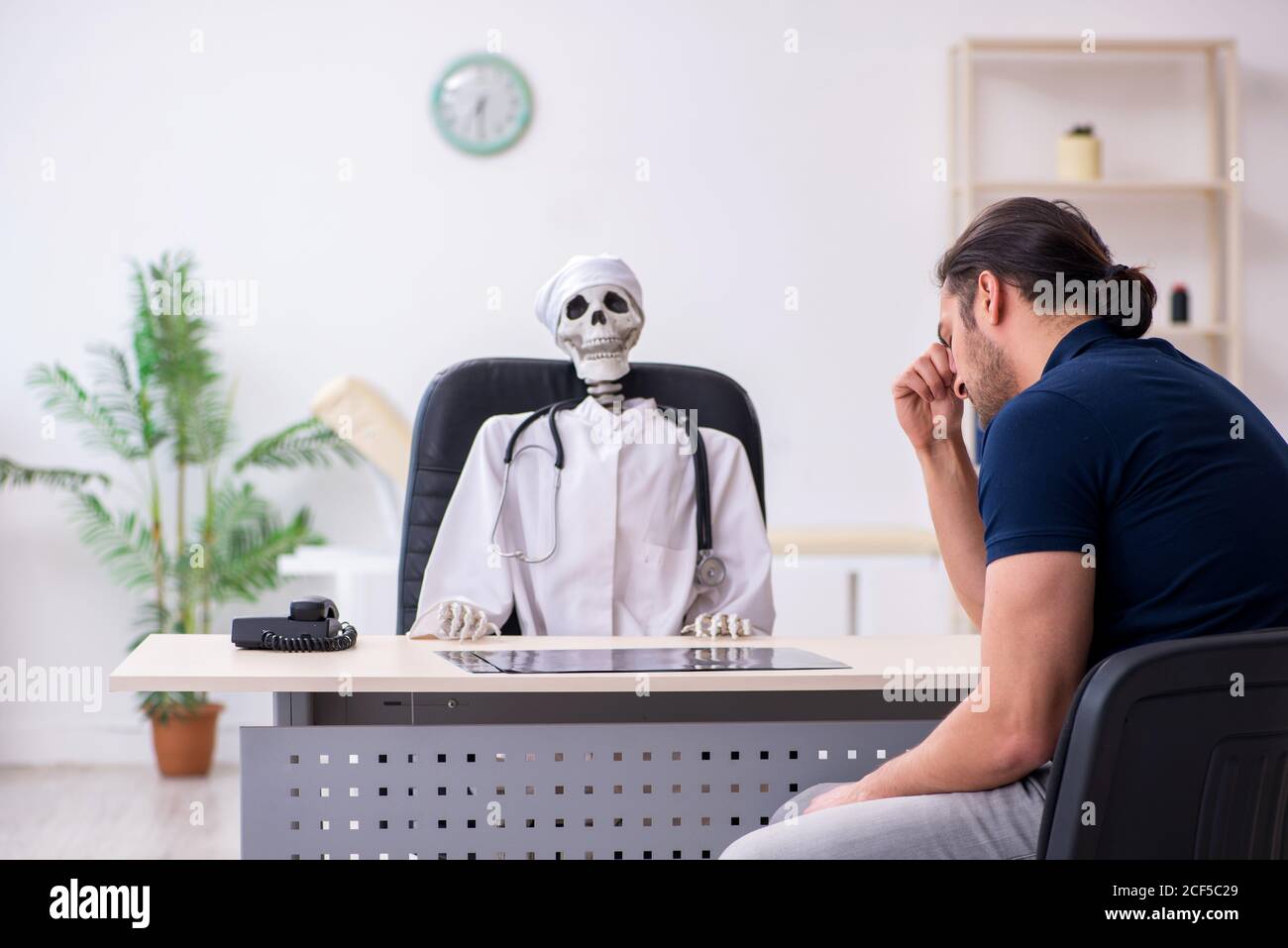 Young man visiting dead doctor in hospital Stock Photo - Alamy