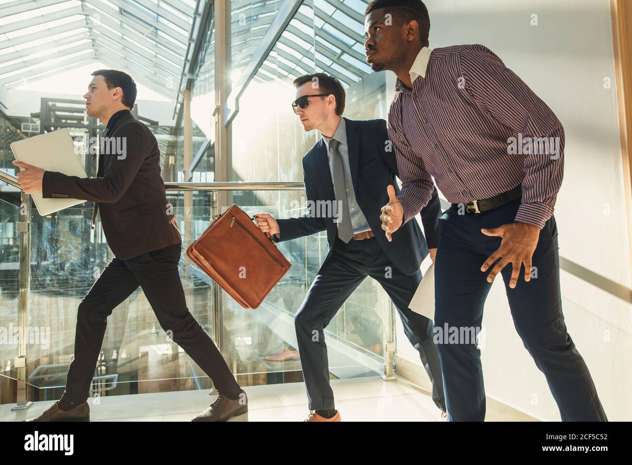 Employee running together hi-res stock photography and images - Alamy