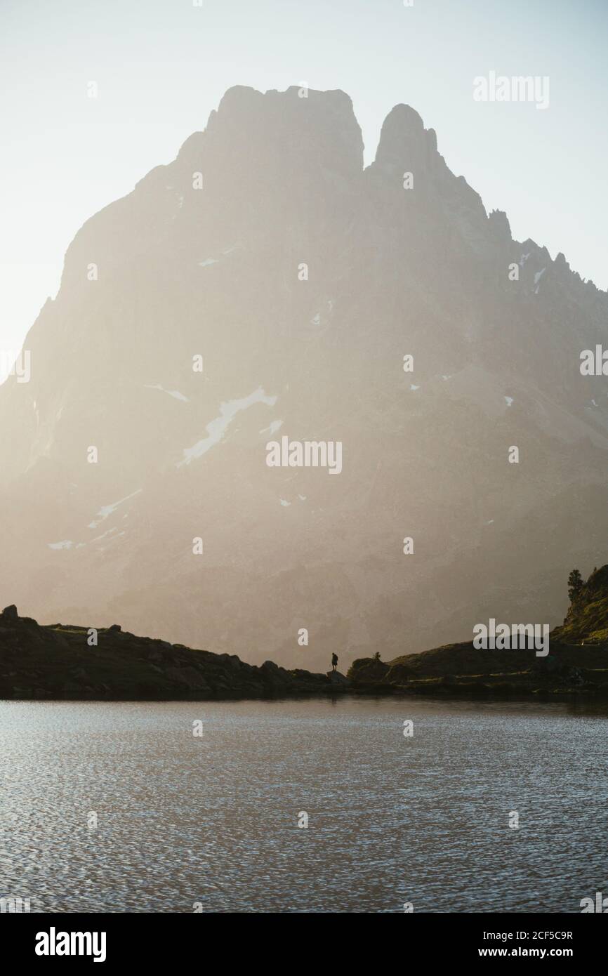 Majestic mountain landscape with human silhouette Stock Photo - Alamy