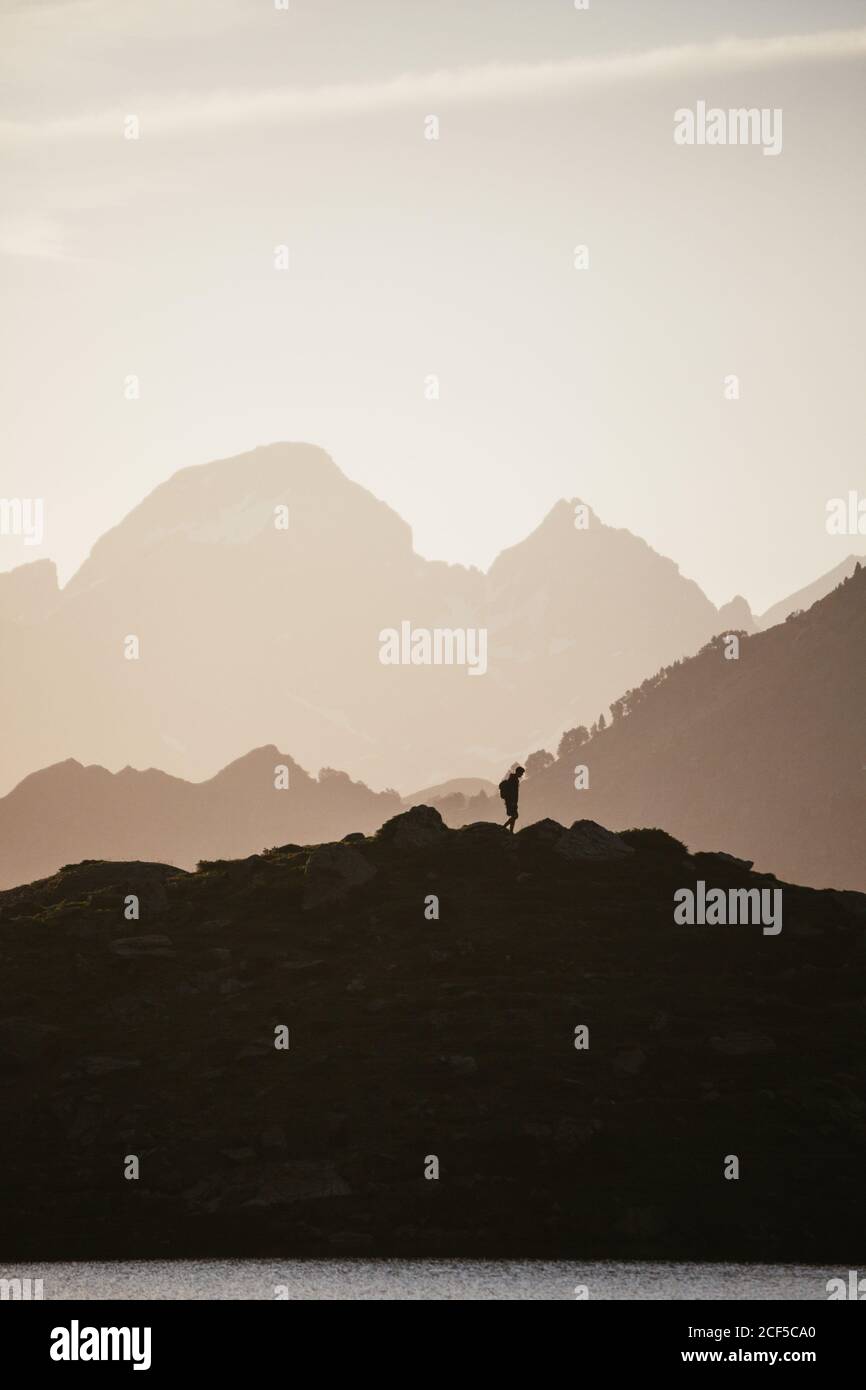 Majestic mountain landscape with human silhouette Stock Photo - Alamy