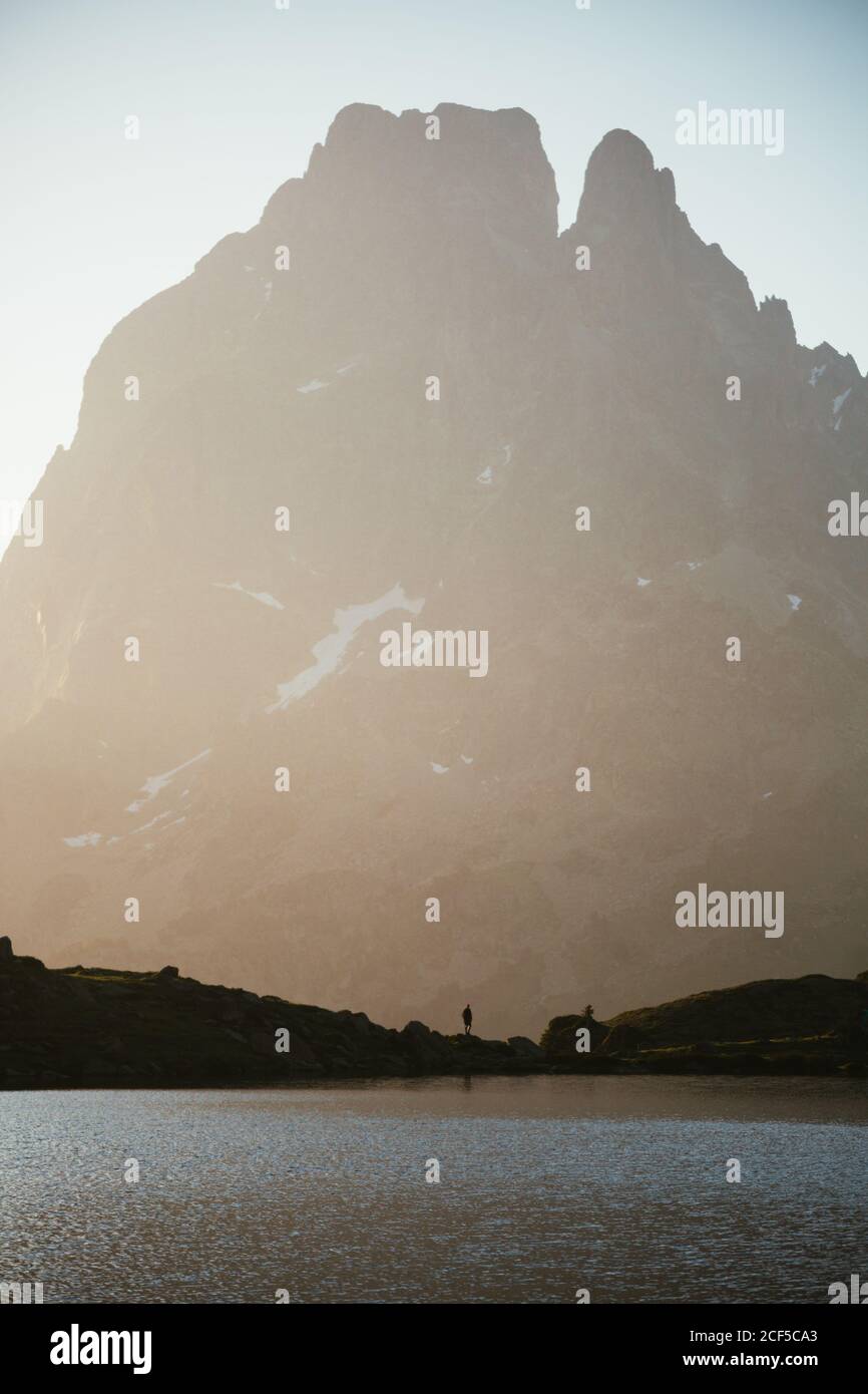 Majestic mountain landscape with human silhouette Stock Photo - Alamy