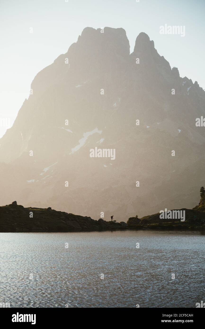 Majestic mountain landscape with human silhouette Stock Photo - Alamy