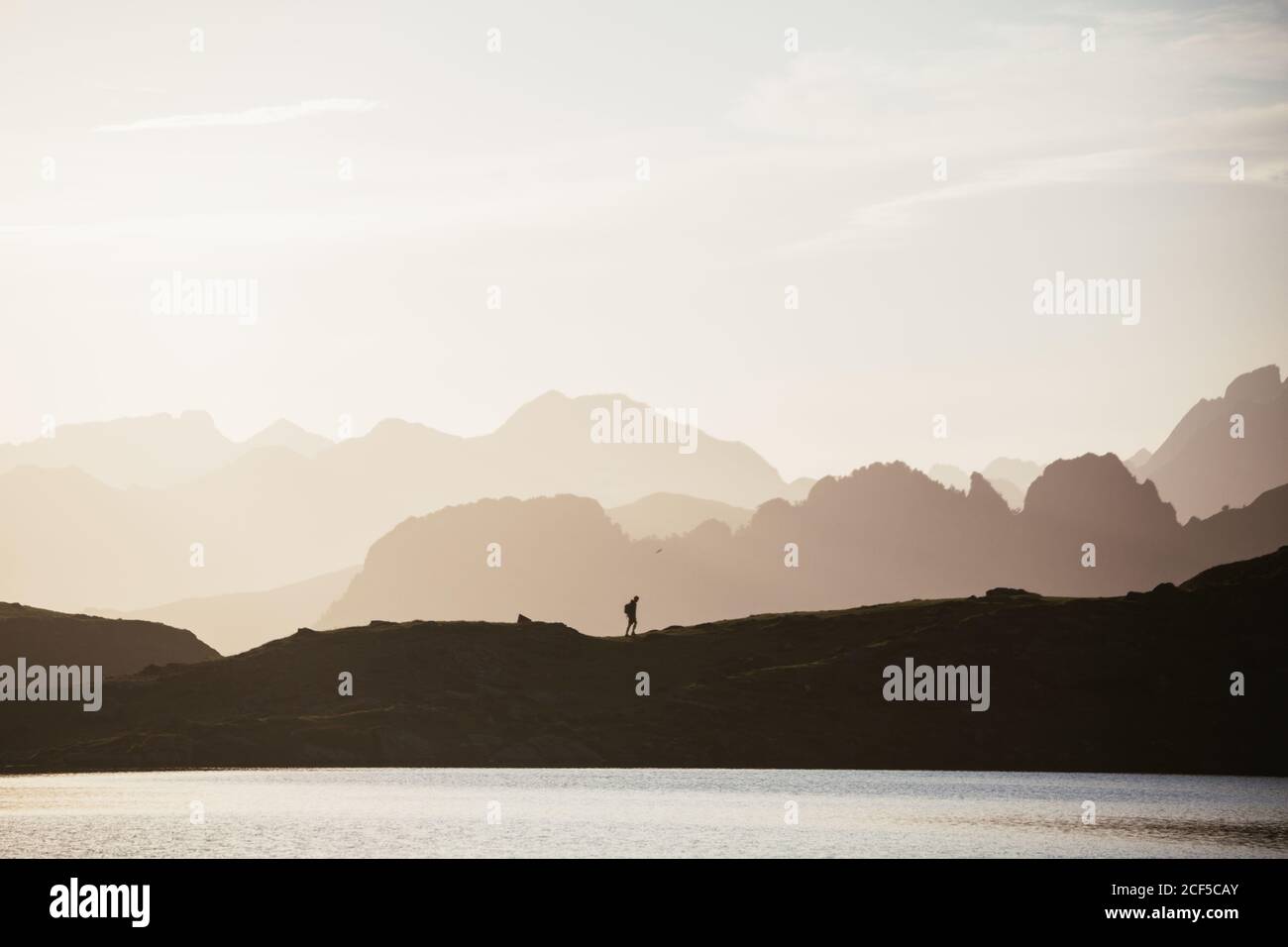Majestic mountain landscape with human silhouette Stock Photo - Alamy