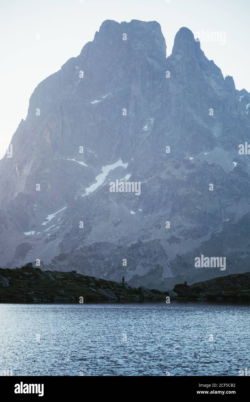 Majestic mountain landscape with human silhouette Stock Photo - Alamy
