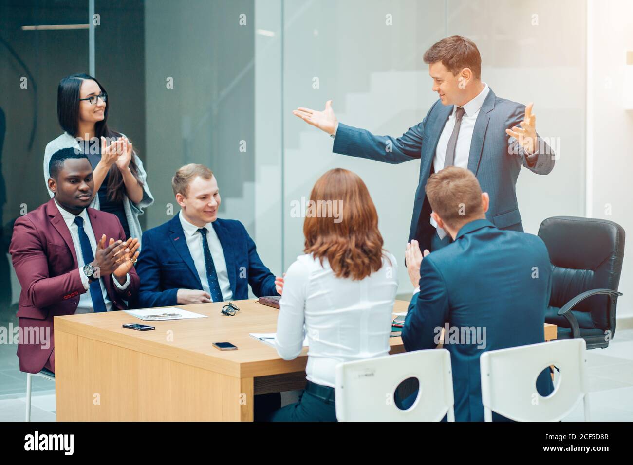 boss leader coaching and teaching in modern office. On the job training ...
