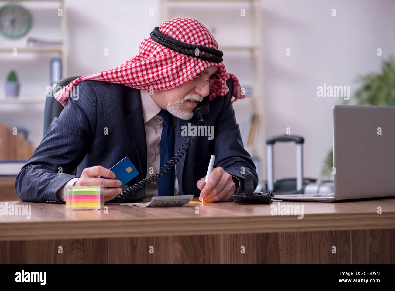 Old arab businessman working in the office Stock Photo - Alamy