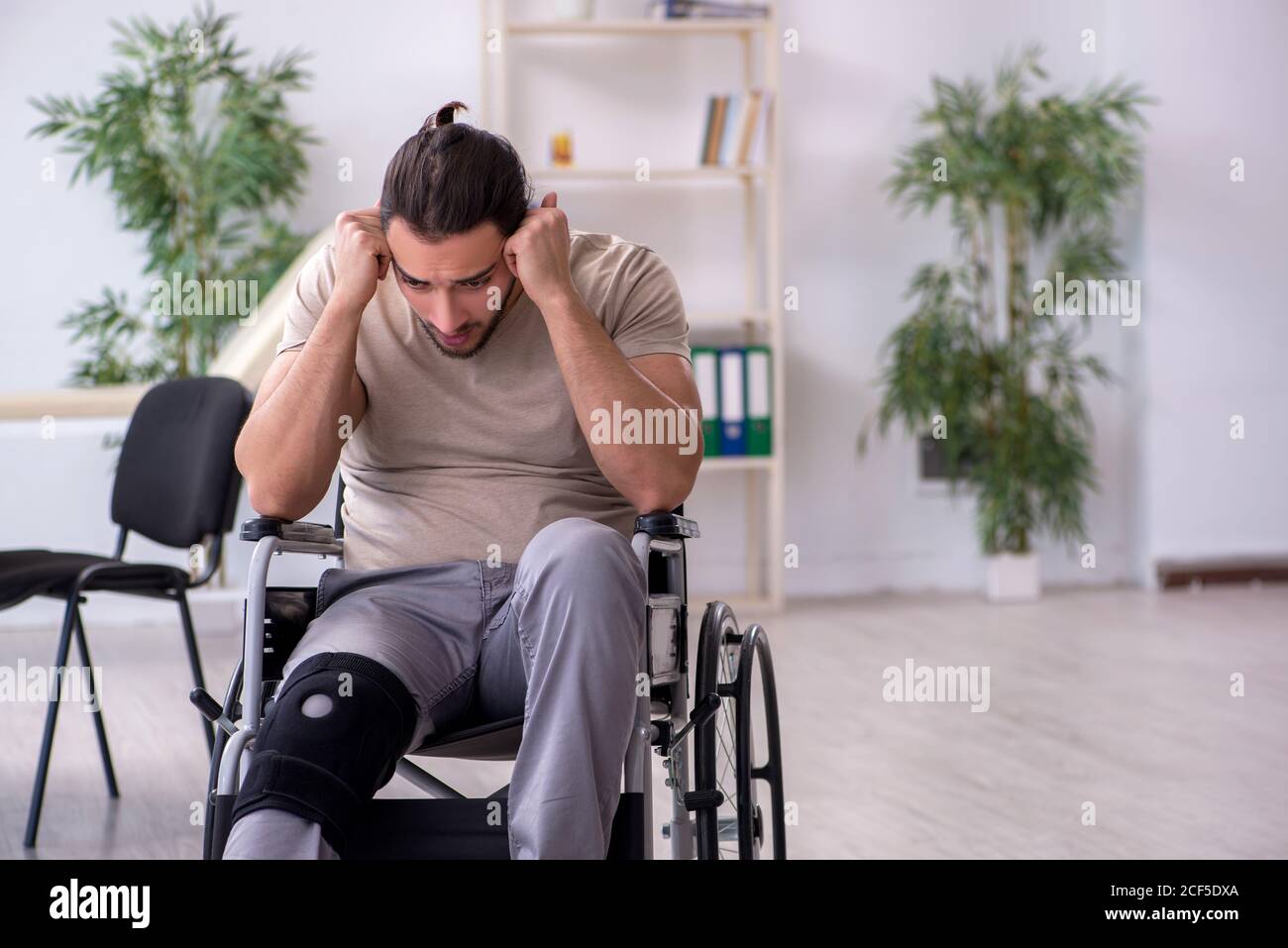 Wheel chair broken leg hi-res stock photography and images - Alamy