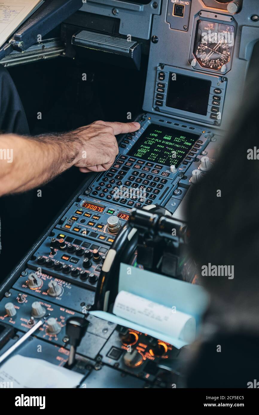 Pilot using flight management system during flight Stock Photo - Alamy