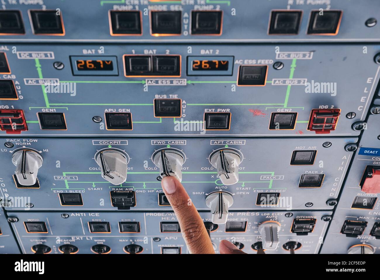 Pilot working with control console during flight Stock Photo - Alamy