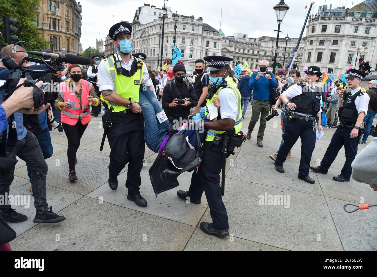 Police arrest a protester at Trafalgar Square during the demonstration ...