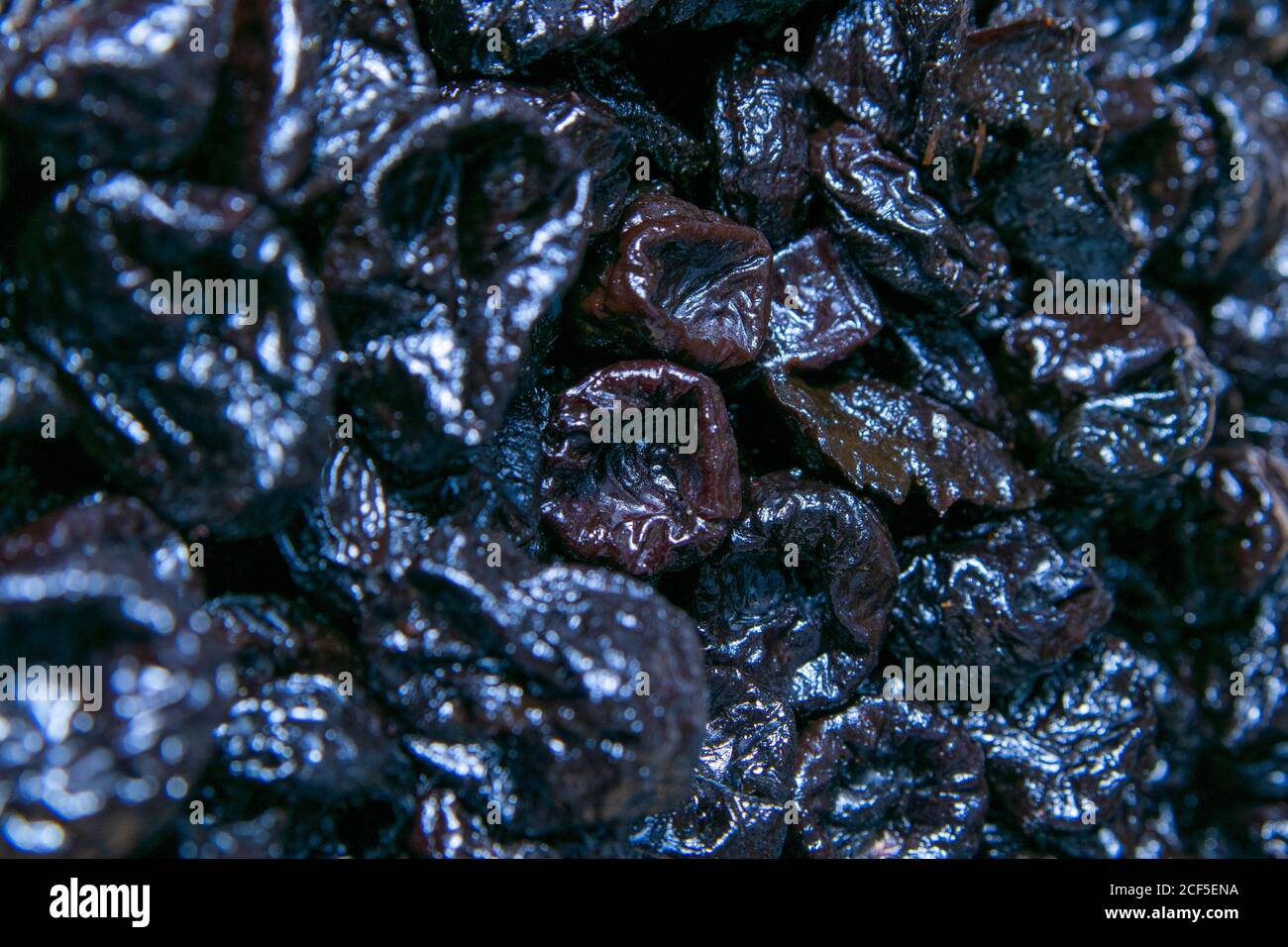 Dry plums or prunes fruit can use as background. Top views, close-up ...