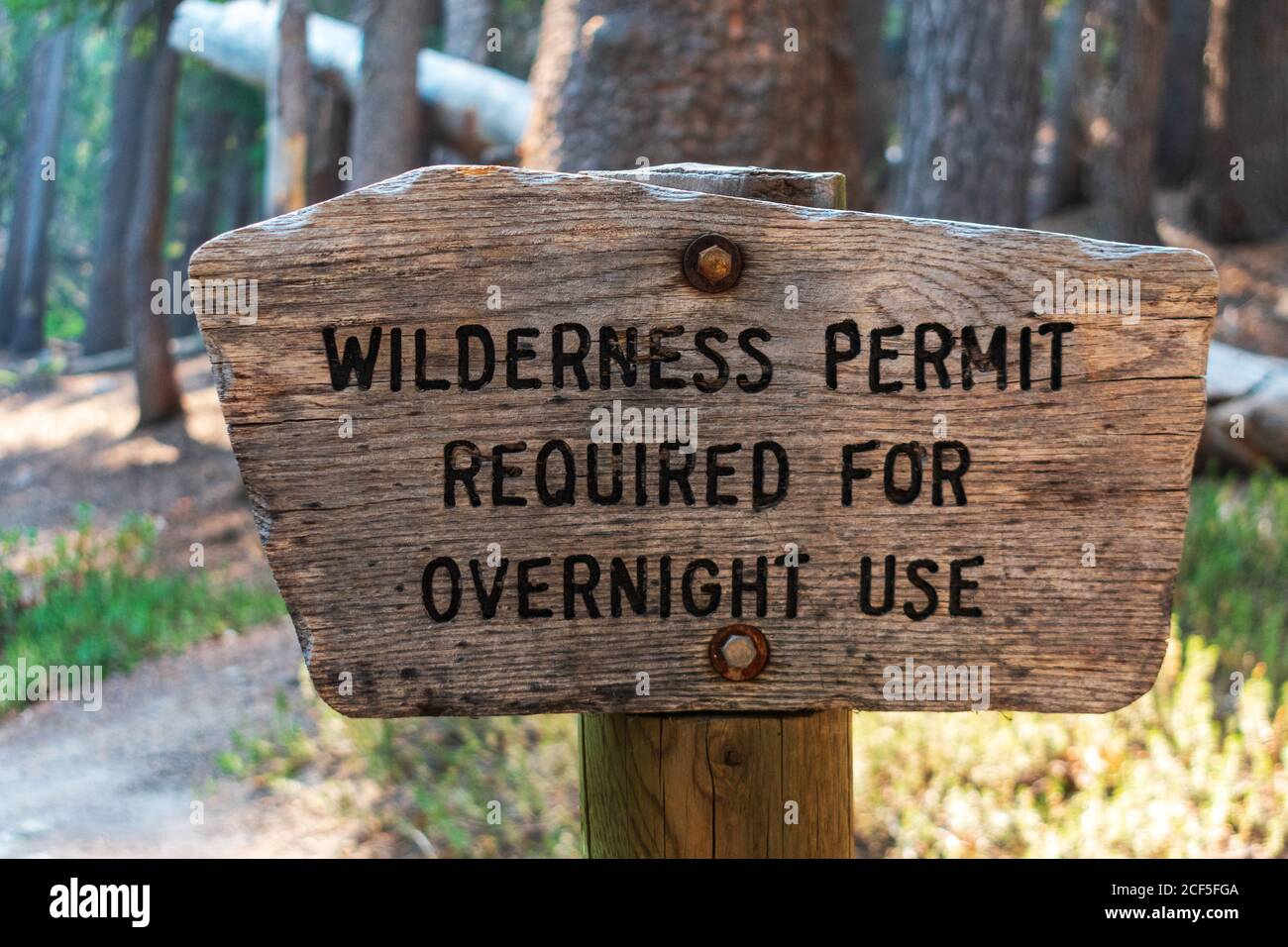 Wilderness permit required for overnight use sign on the wooden post in ...