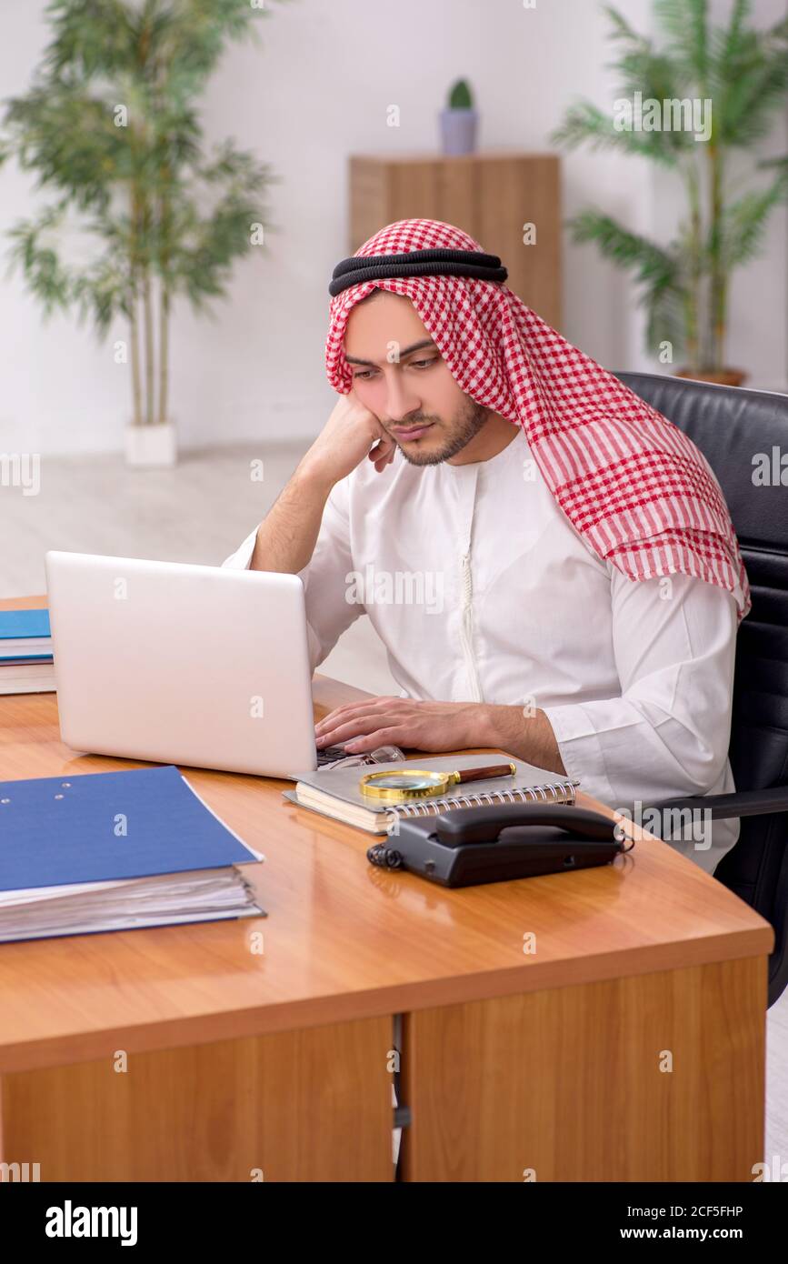 Male arab employee working in the office Stock Photo - Alamy