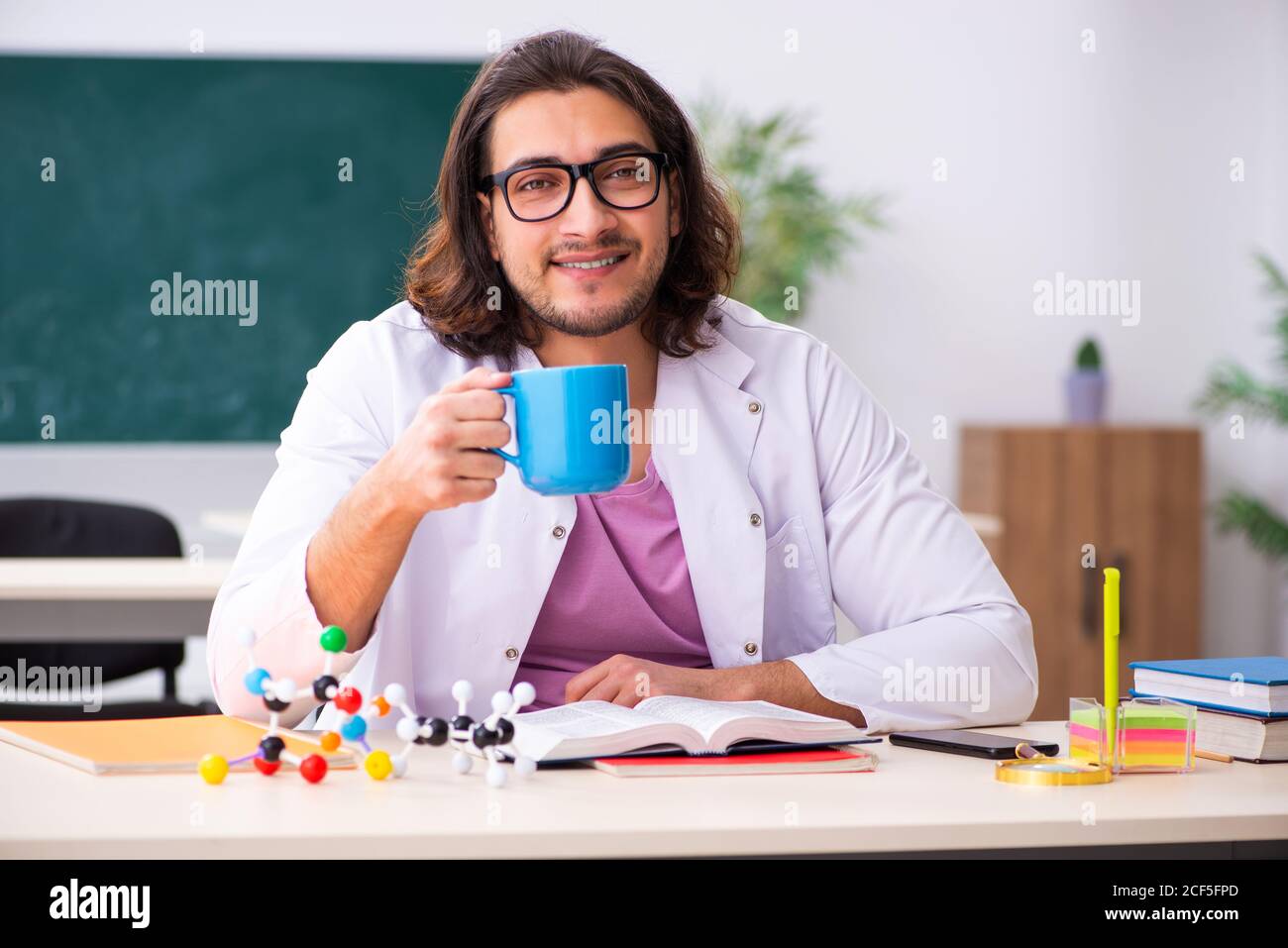 Young physicist in the classroom Stock Photo - Alamy