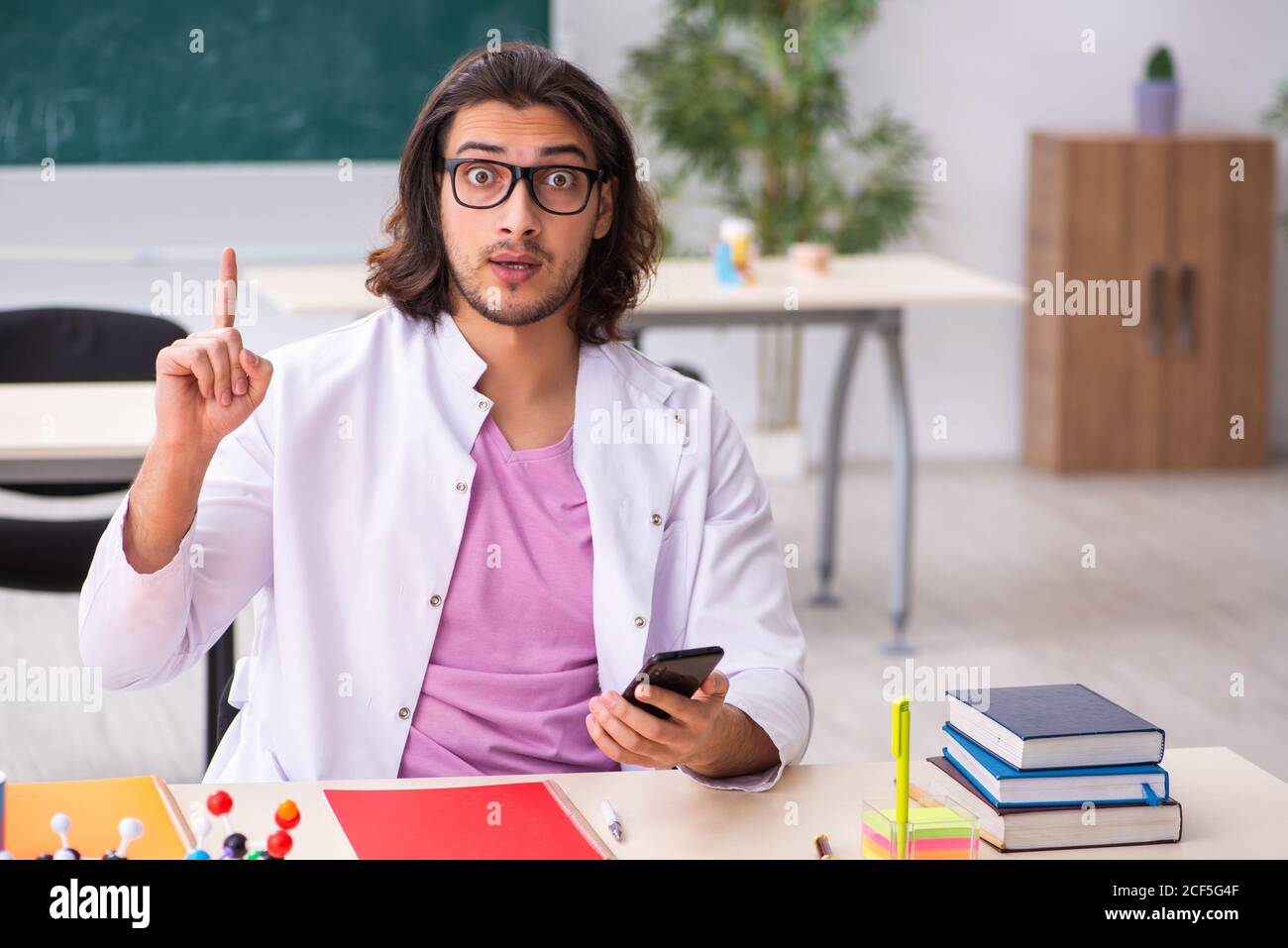 Young physicist in the classroom Stock Photo - Alamy