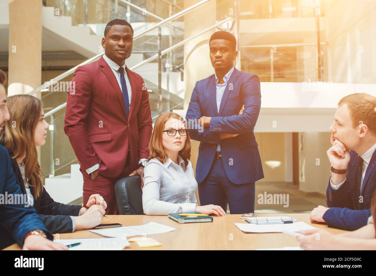 Woman addressing group of men hi-res stock photography and images - Alamy