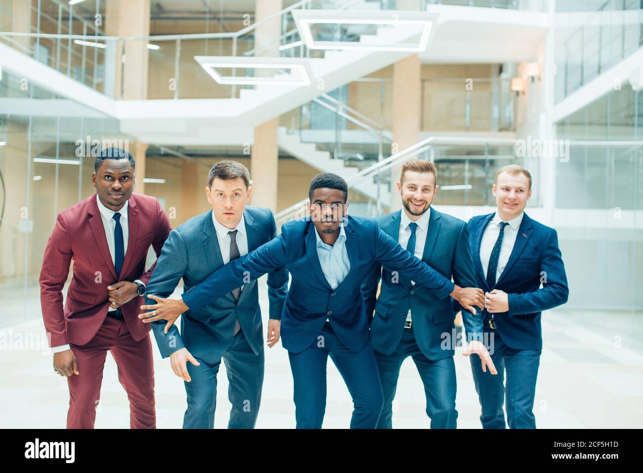 Portrait of business people ready for competition Stock Photo - Alamy