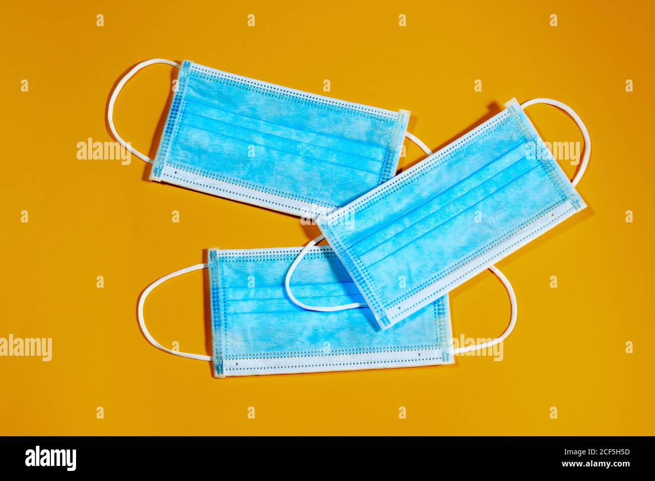 94/5000group of three blue single-use masks for virus protection on ...