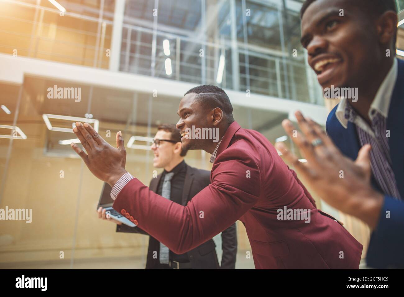 Three diverse businesspeople smiling hi-res stock photography and ...