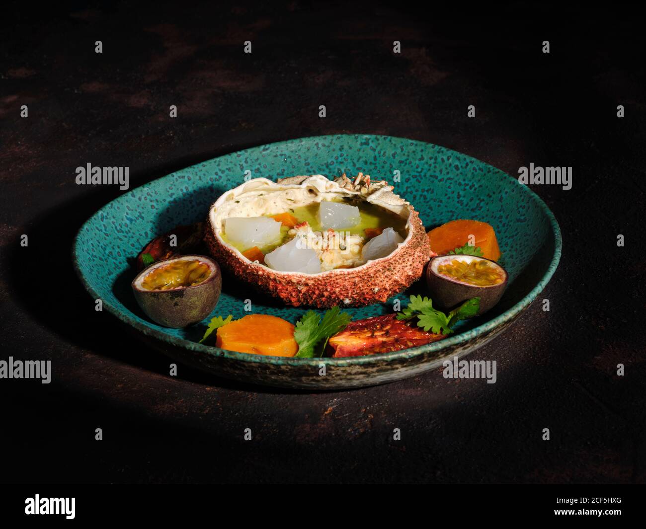 Top view of delectable ceviche served in spider crab shell with ...