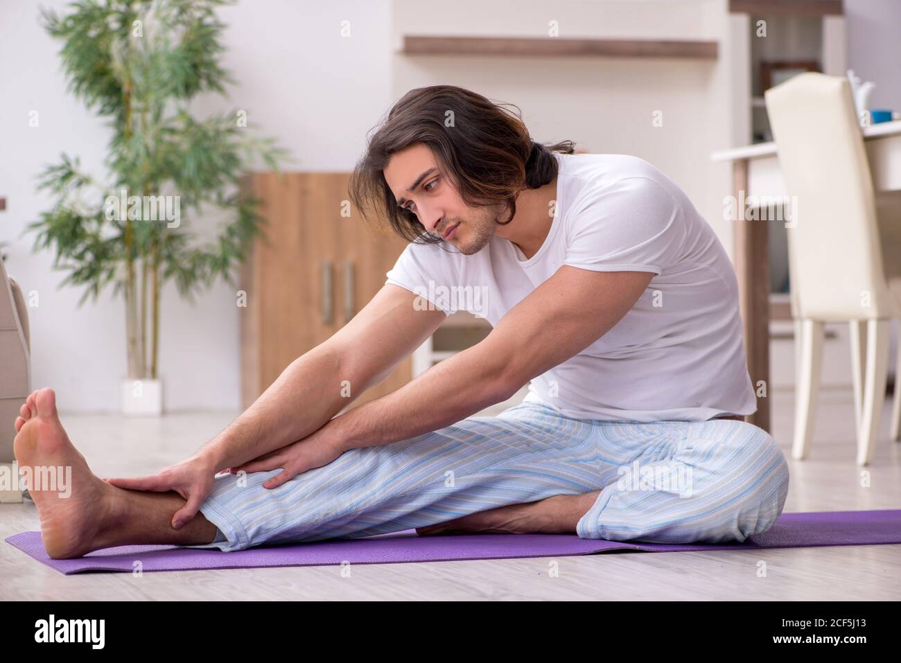 Man starting day with morning exercises Stock Photo - Alamy