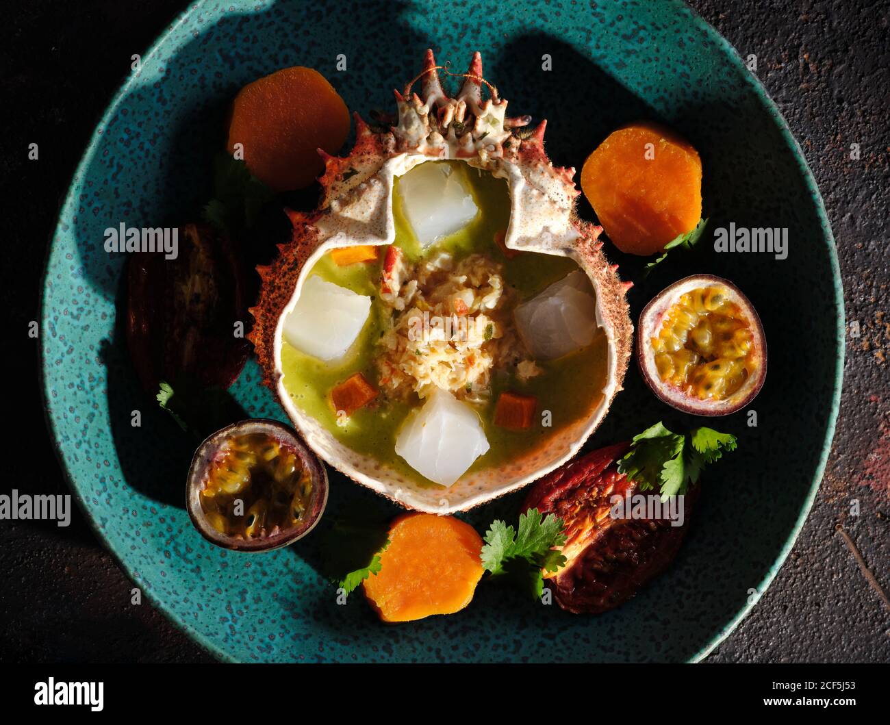 Top view of delectable ceviche served in spider crab shell with ...
