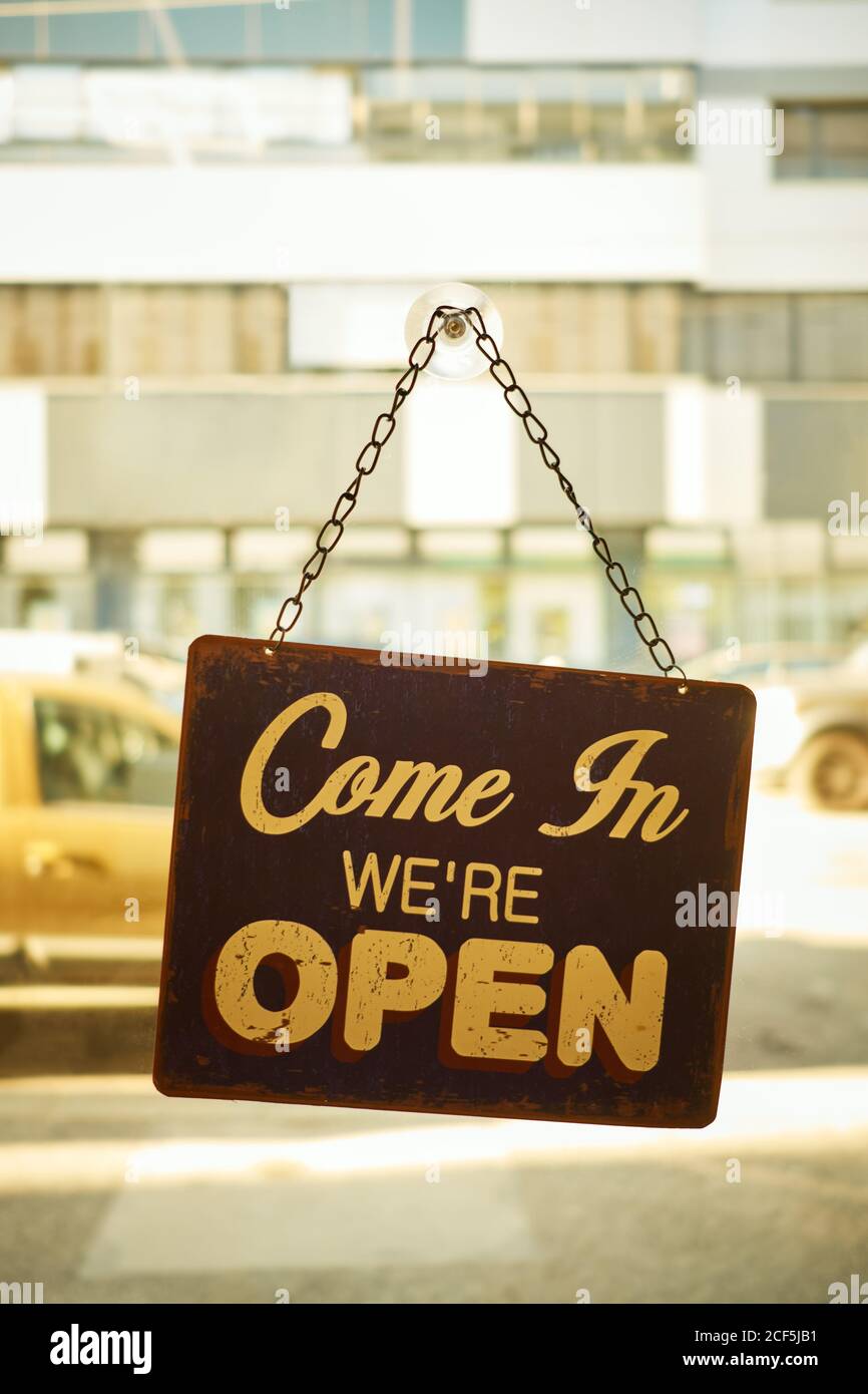 Open sign at small business window with blurred background Stock Photo ...